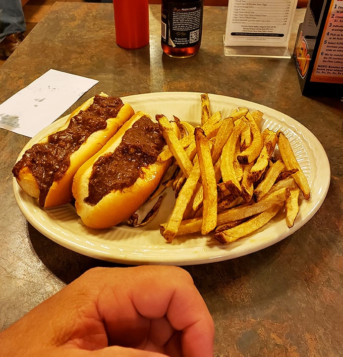 The star attraction in all its unpretentious glory. Two perfectly dressed coney dogs with a mountain of hand-cut fries – lunch doesn't get more honest than this.
