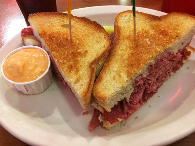 This isn't just a sandwich; it's an engineering marvel of perfectly stacked corned beef between golden-grilled rye. The side of sauce is purely ceremonial.