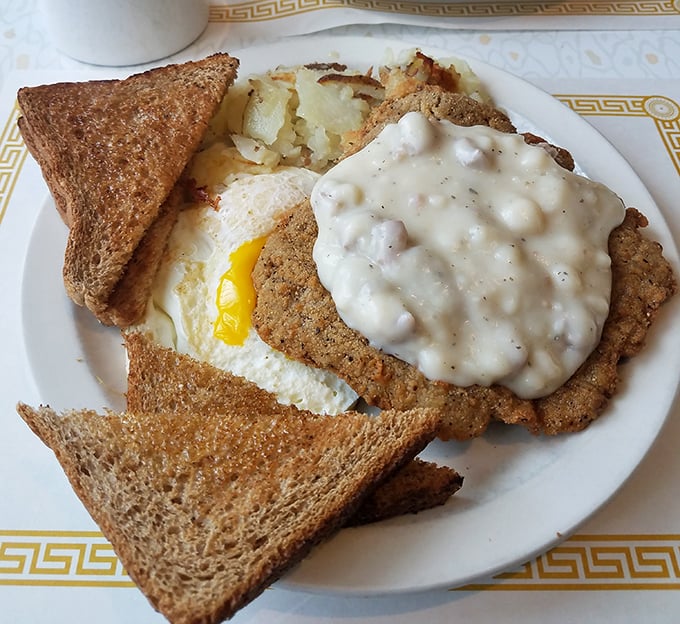 Country fried steak that could make a vegetarian weep – crispy exterior, tender inside, and gravy that deserves its own fan club.