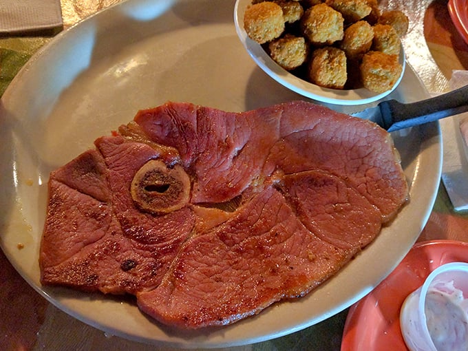 Behold the star attraction—country ham in all its pink, salt-cured glory. This isn't just breakfast; it's a Tennessee tradition served on a plate.