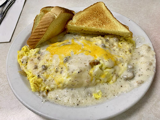 Behold the Country Omelette in all its glory—where eggs, cheese, and sausage gravy unite in a breakfast symphony that makes morning people out of night owls.