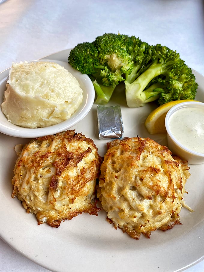 Golden-brown perfection: two jumbo lump crab cakes with minimal filler, maximum flavor. Mashed potatoes and broccoli complete the holy trinity of comfort.