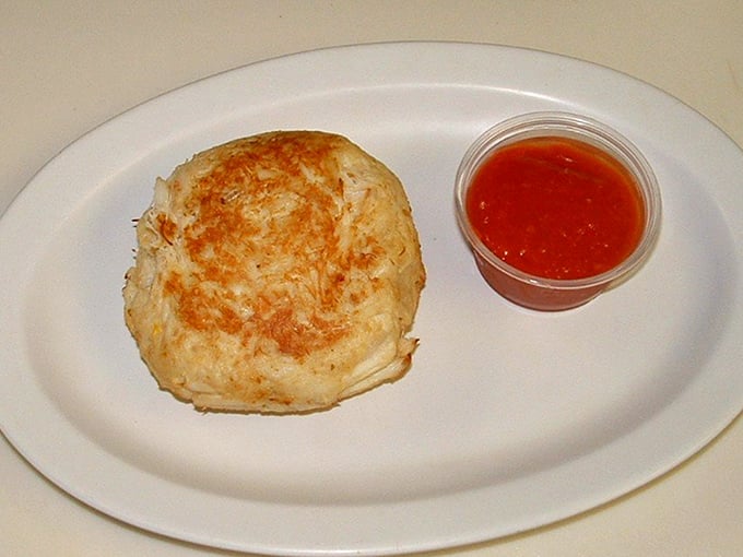 This crab cake isn't trying to impress with fancy presentation—it's too busy being absolutely perfect in its simplicity.