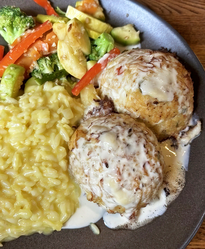 Behold the stars of the show: Buckley's legendary crab cakes, where sweet lump meat meets culinary magic. Served with creamy risotto that's worth every calorie.