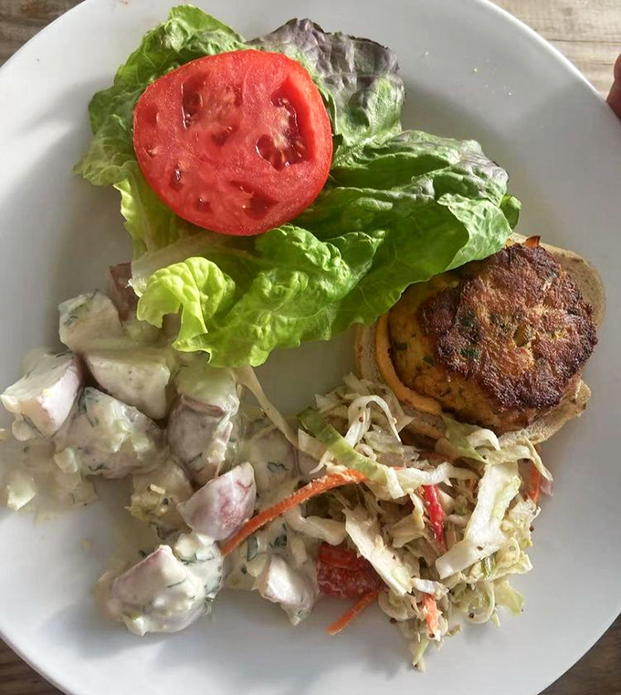 Behold the star of the show—a golden-brown crab cake that's more crab than cake, served with classic sides that know their supporting role.