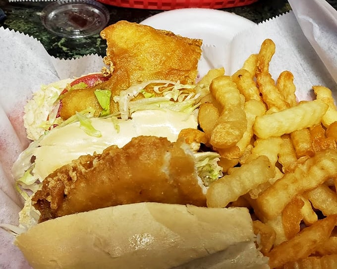 The holy trinity of Delaware dining: golden-fried seafood, crispy fries, and just enough greenery to pretend you're eating balanced.