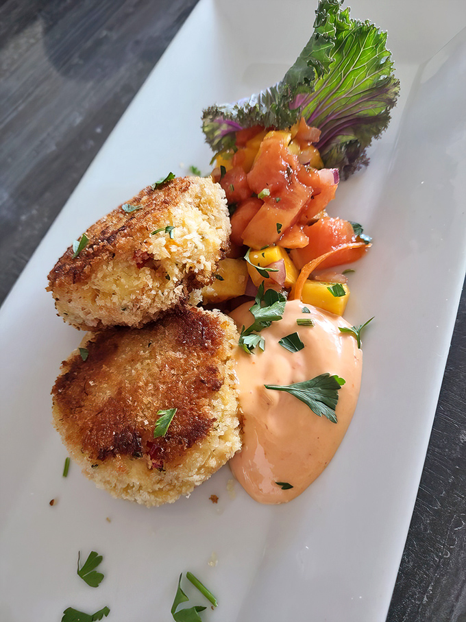These golden-brown crab cakes are what food dreams are made of—mostly crab, minimal filler, and a sauce that deserves its own fan club.