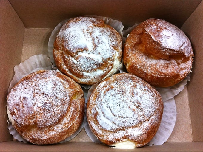 These cream puffs aren't just desserts—they're cloud-like vessels of joy dusted with powdered sugar promises. Worth every mile of the drive.
