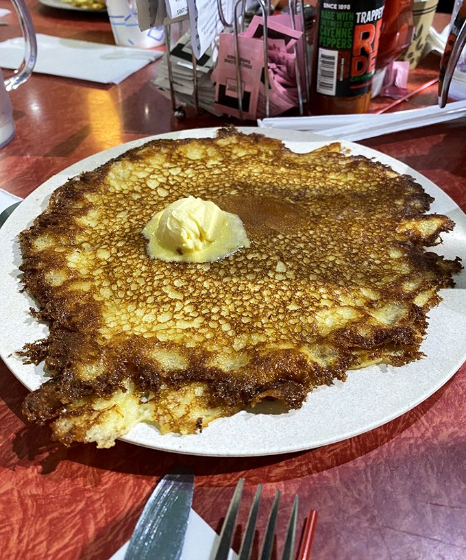 Behold the holy grail of pancakes—crispy, lacy edges that shatter like caramelized sugar giving way to a tender center crowned with melting butter.