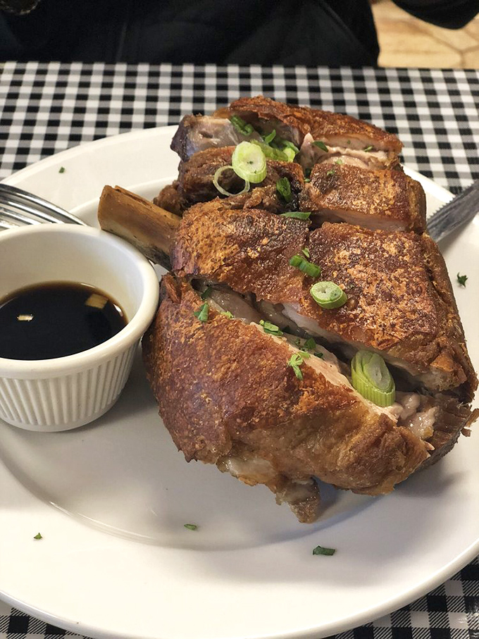 Behold the crispy pata in all its glory—a pork hock transformed into a masterpiece that makes Southern fried chicken look like amateur hour.