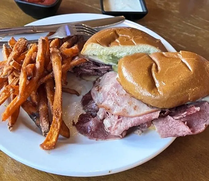 The Cuban that launched a thousand road trips. Those sweet potato fries aren't just a side dish—they're a supporting actor deserving their own award.