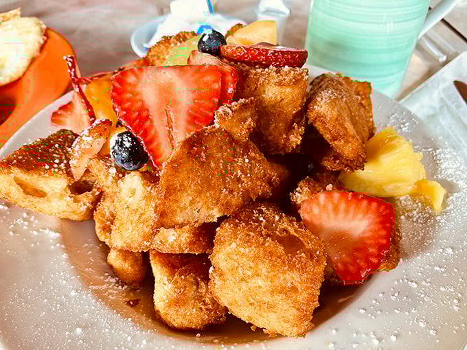 Cuban French Toast that would make your cardiologist wince and your taste buds sing – golden cubes of homemade bread with fresh fruit that's breakfast's answer to dessert.