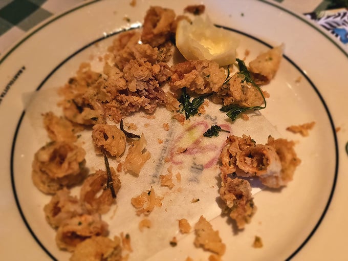 Golden-fried calamari that shatters with each bite, revealing tender squid beneath. This isn't bar food—it's an edible love letter.