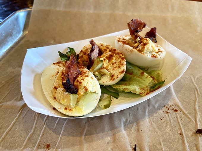 Deviled eggs elevated to art form: creamy yolk perfection topped with crispy bacon. Grandma's recipe just got schooled in the fine art of indulgence.