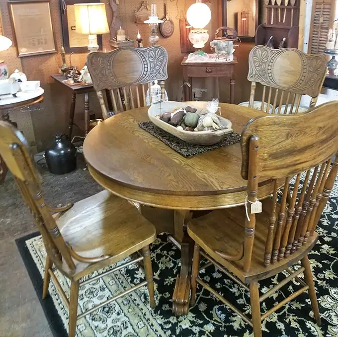 This isn't just a dining set—it's a silent witness to decades of family meals, holiday gatherings, and late-night conversations. Those press-back chairs have heard it all.