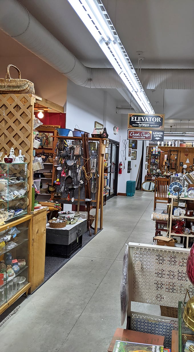 Follow the signs to discover even more treasures below. The elevator beckons with promises of "Antiques" and "Quality Crafts" waiting on the lower level.
