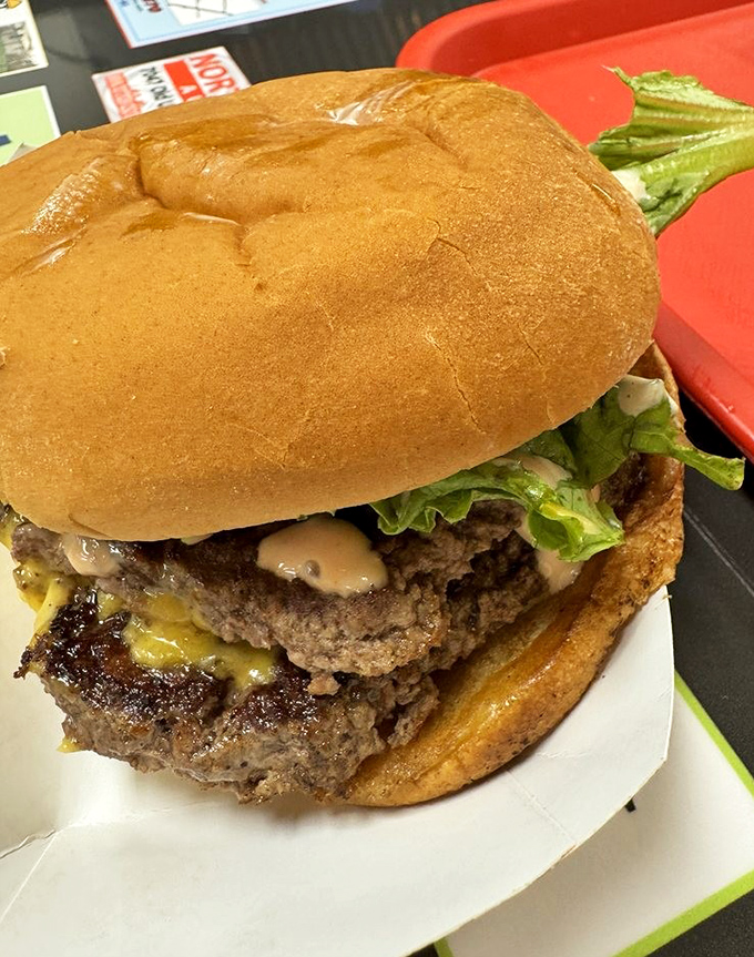 Behold the Double Mac – where multiple beef patties unite in a glorious tower of flavor that requires both hands and zero shame.