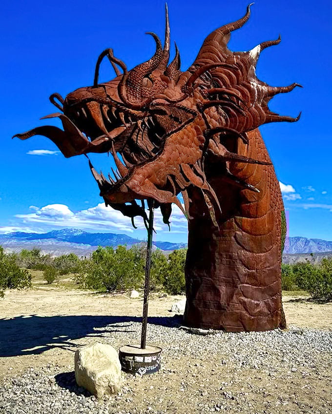 Up close, the dragon's intricate metalwork reveals the artist's extraordinary attention to detail—each scale and spine a testament to human creativity in this desolate landscape.