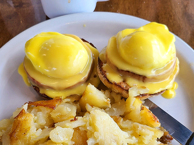 Behold, the Benedict that launched a thousand food pilgrimages. That hollandaise sauce isn't just yellow, it's liquid sunshine on a plate.