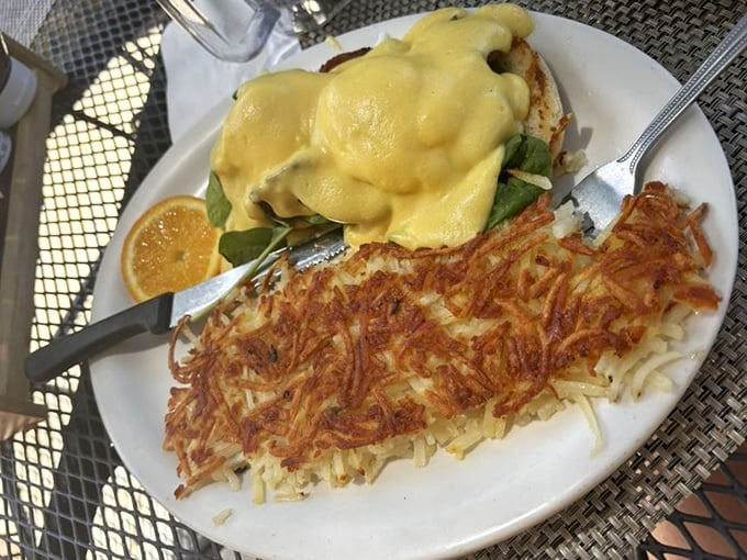This Eggs Benedict isn't just breakfast—it's architecture. Those crispy hash browns could qualify as their own zip code.