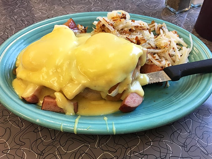 Behold the star attraction: eggs Benedict draped in sunshine-yellow hollandaise that cascades perfectly over Canadian bacon and a toasted English muffin.