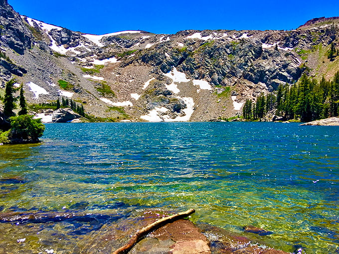 Emigrant Lake sparkles like nature's own infinity pool, reflecting snow-capped peaks that would make Swiss postcards jealous.