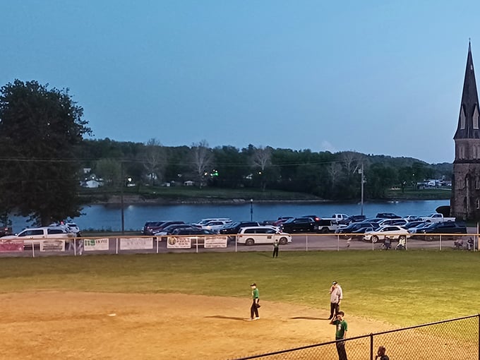 Twilight baseball with the river as backdrop – small-town America doesn't get more authentic than this magical summer evening scene.