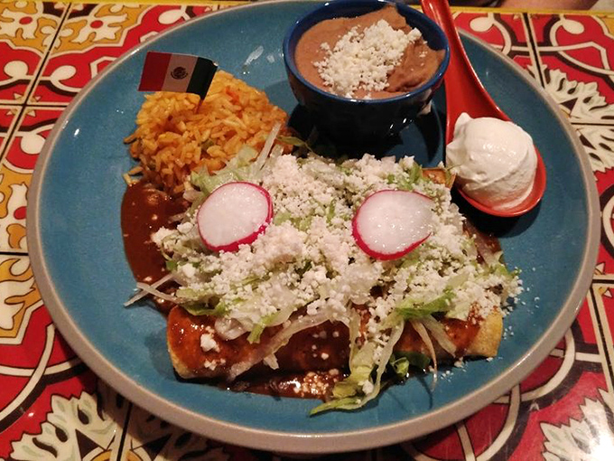 These enchiladas don't just arrive at your table—they make an entrance. Crowned with cotija cheese and radish slices, they're dressed better than most wedding guests.