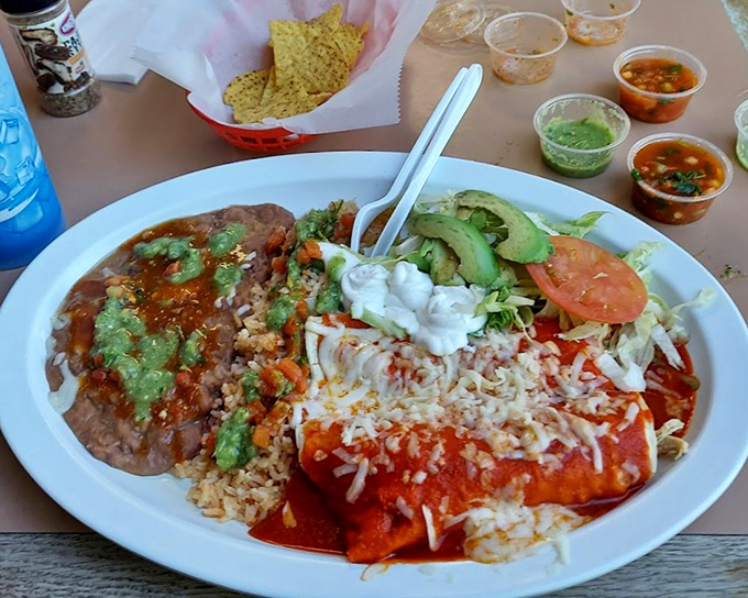 This plate doesn't just feed you—it hugs you from the inside. Those enchiladas swim in sauce that's been perfected over generations.