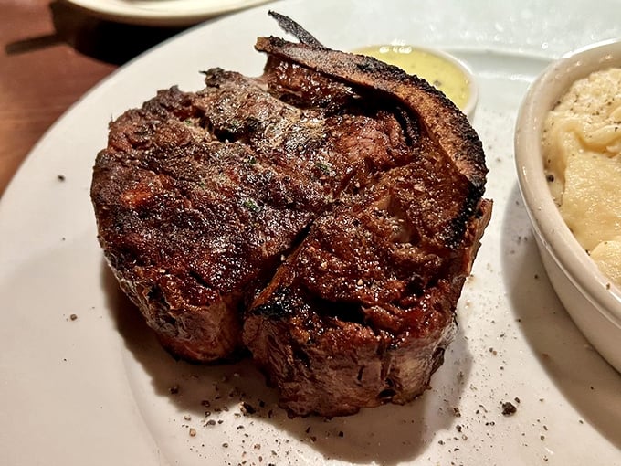 Behold the filet mignon in its natural habitat – perfectly charred exterior, blushing interior, and not a single unnecessary garnish in sight.