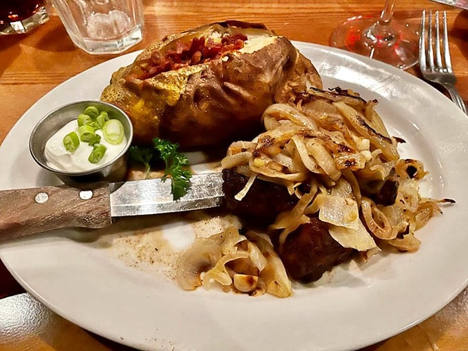 A loaded baked potato and steak with caramelized onions – proof that happiness doesn't need to be complicated, just perfectly executed.