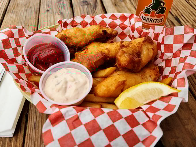 Golden-battered fish that shatters like glass alongside crispy fries—this isn't just food, it's an edible love letter to the ocean.