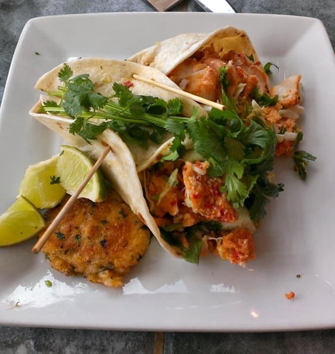 These aren't just fish tacos—they're edible postcards from the Oregon coast. Fresh catch, bright cilantro, and a squeeze of lime create perfect harmony.