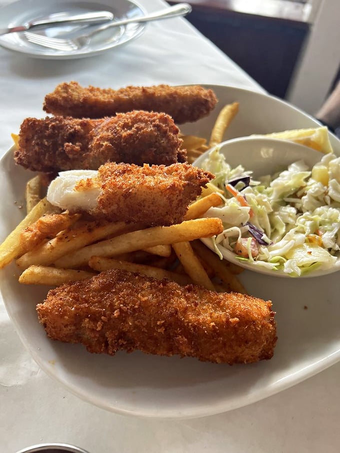 Golden-battered fish that shatters with each bite, alongside fries that maintain their dignity even when doused with malt vinegar. Seafood perfection!