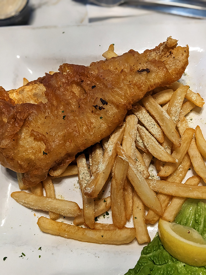 Golden, crispy perfection meets flaky white fish – this isn't just fish and chips, it's what fish dreams of becoming when it grows up.