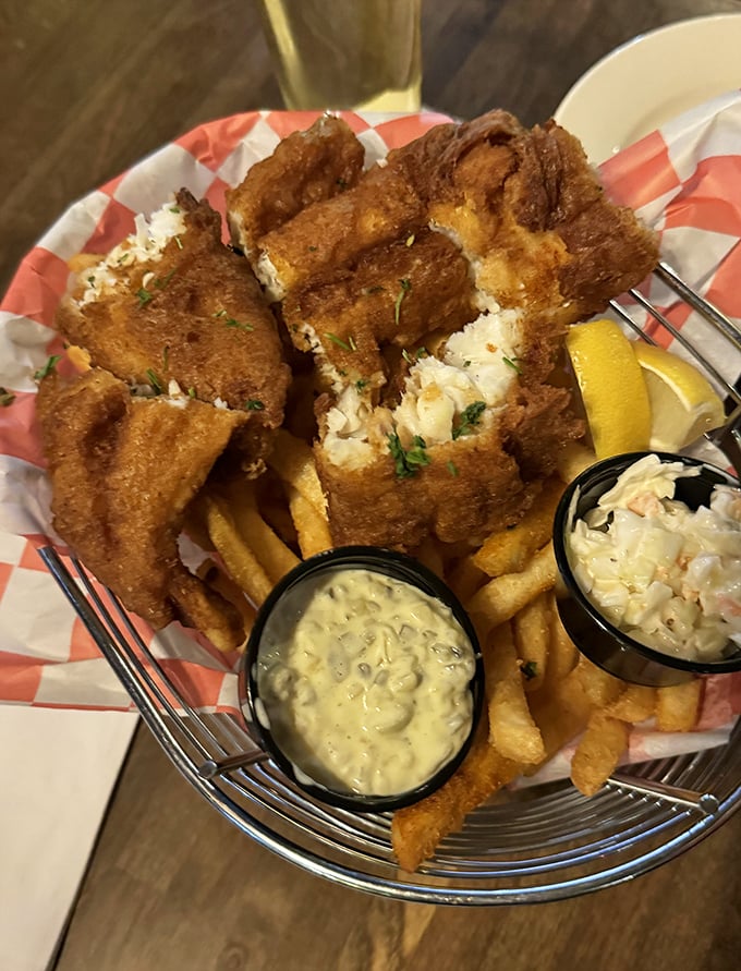 Golden-battered fish that shatters with each bite, alongside hand-cut chips that would make Dublin proud—this is fish and chips done right.