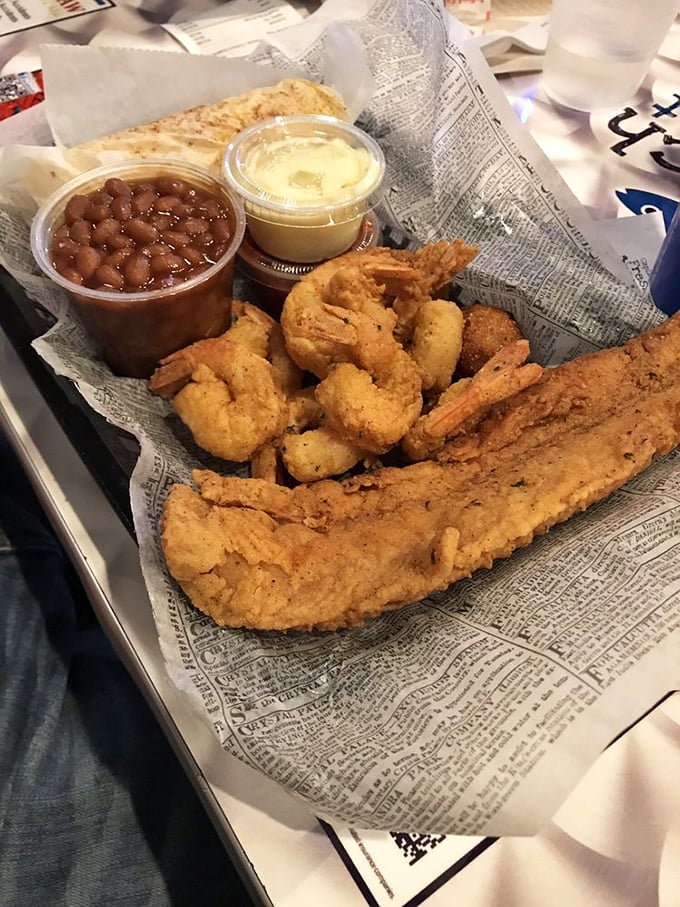 Golden-fried perfection that would make Neptune himself weep with joy. The newspaper lining isn't just nostalgic—it's practical for soaking up all that deliciousness.