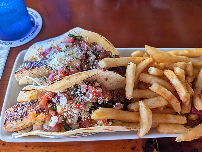 These fish tacos aren't just a meal, they're a beach vacation on a plate – fresh-caught fish, vibrant pico, and that sprinkle of cheese that makes everything better. 