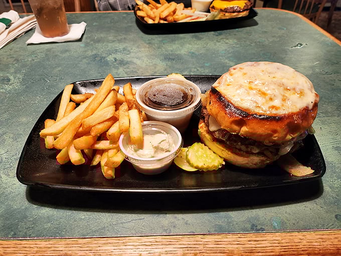 Behold the French Onion Burger – where cheese meets beef in a glorious, melty embrace of deliciousness.
