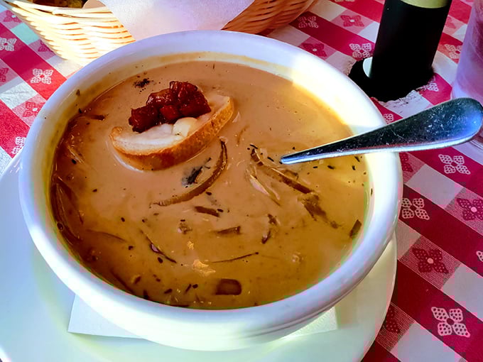 This isn't just French onion soup – it's a golden-hued bowl of comfort that makes you want to write sonnets about cheese pulls.
