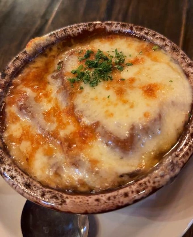 Behold the star of our show—French onion soup with a cheese pull so magnificent it deserves its own Pennsylvania zip code.