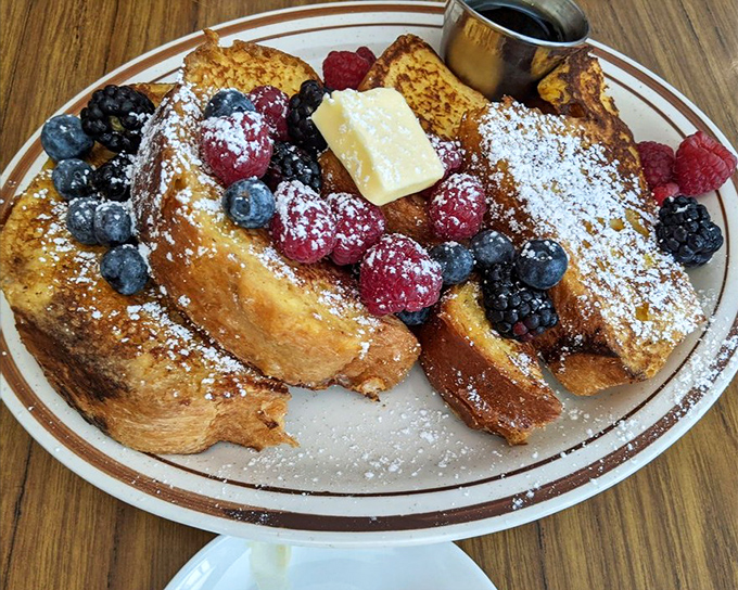 French toast that deserves its own SAG card. Those berries aren't just garnish—they're supporting actors in a breakfast blockbuster.