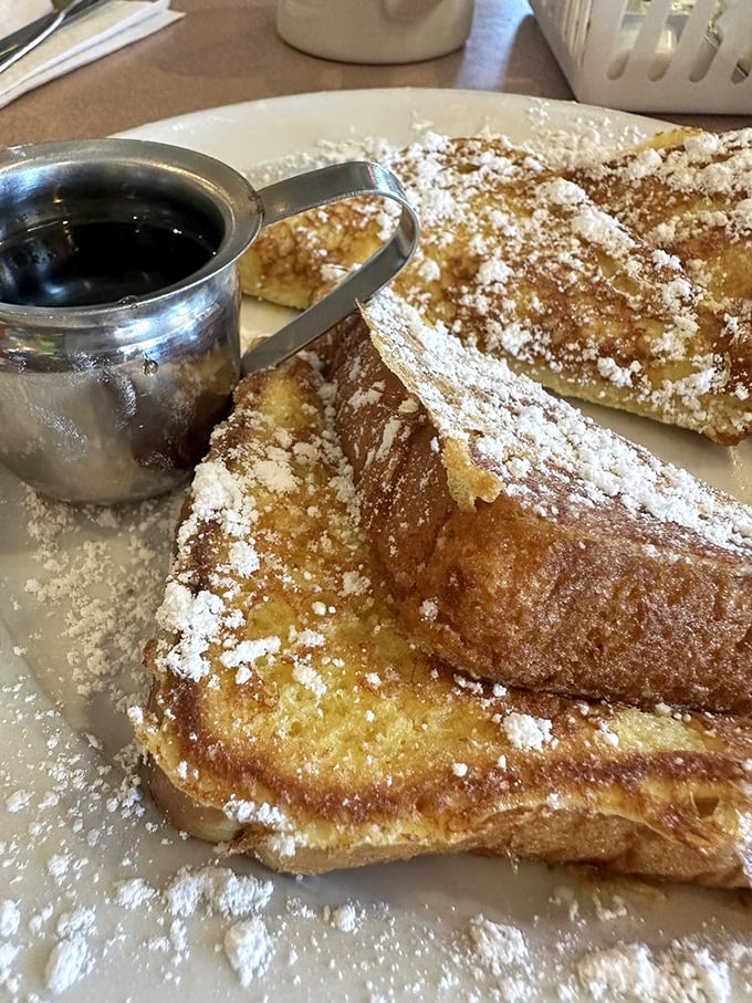 French toast that doesn't just whisper "good morning"—it belts out a full Broadway number complete with powdered sugar snow.