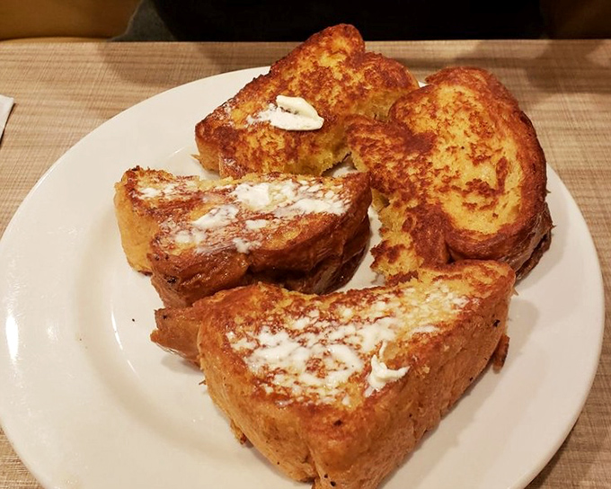 The French toast at Lou Mitchell's doesn't just look good – it's the kind of breakfast that makes you want to high-five strangers at neighboring tables.