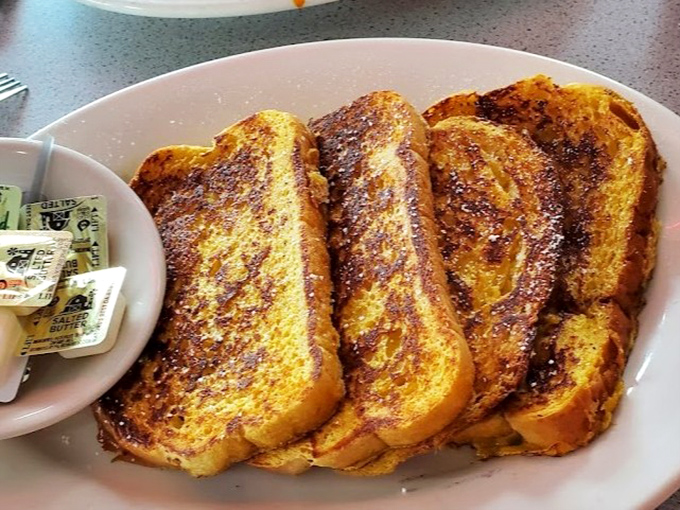 Golden-brown perfection that whispers, "Take a picture if you must, but I'm getting cold." This French toast doesn't need filters to impress.