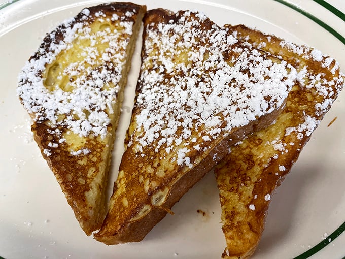 The star of the show: French toast dusted with powdered sugar. Golden, crispy exterior hiding a custardy center that's worth the drive.