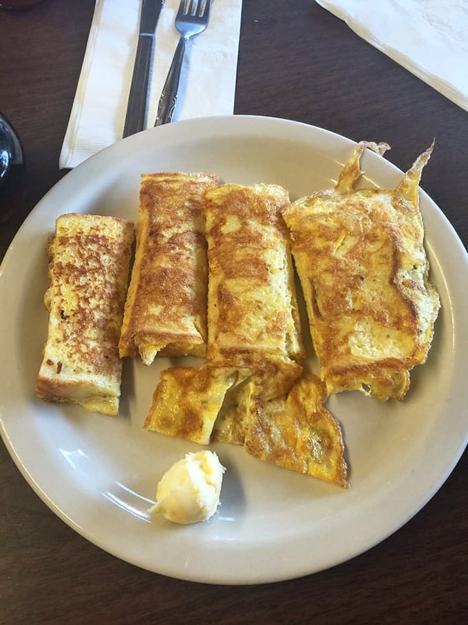 Golden-brown French toast that's crispy outside, custardy inside. This isn't just breakfast—it's the reason alarm clocks were invented.