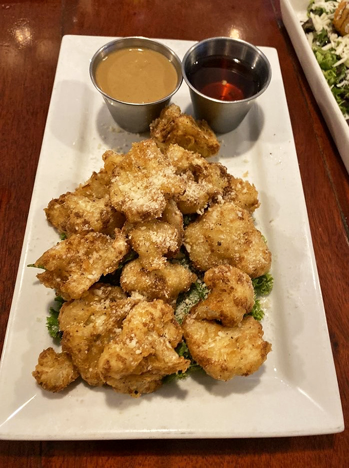 Golden perfection achieved: fried cauliflower that converts vegetable skeptics faster than a televangelical sermon on Sunday morning.