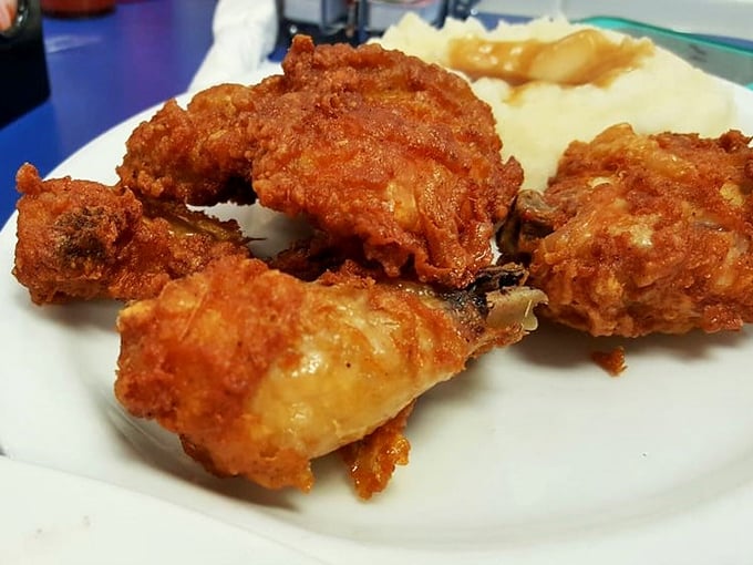 Golden-brown fried chicken that makes a satisfying crunch you can practically hear through the photo. Crispy exterior, juicy interior—the universal language of comfort.