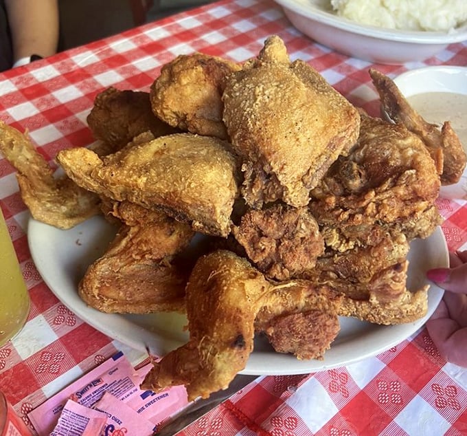 Golden-brown perfection that makes you want to slap the table. This isn't just fried chicken—it's edible history with a side of culinary reverence.